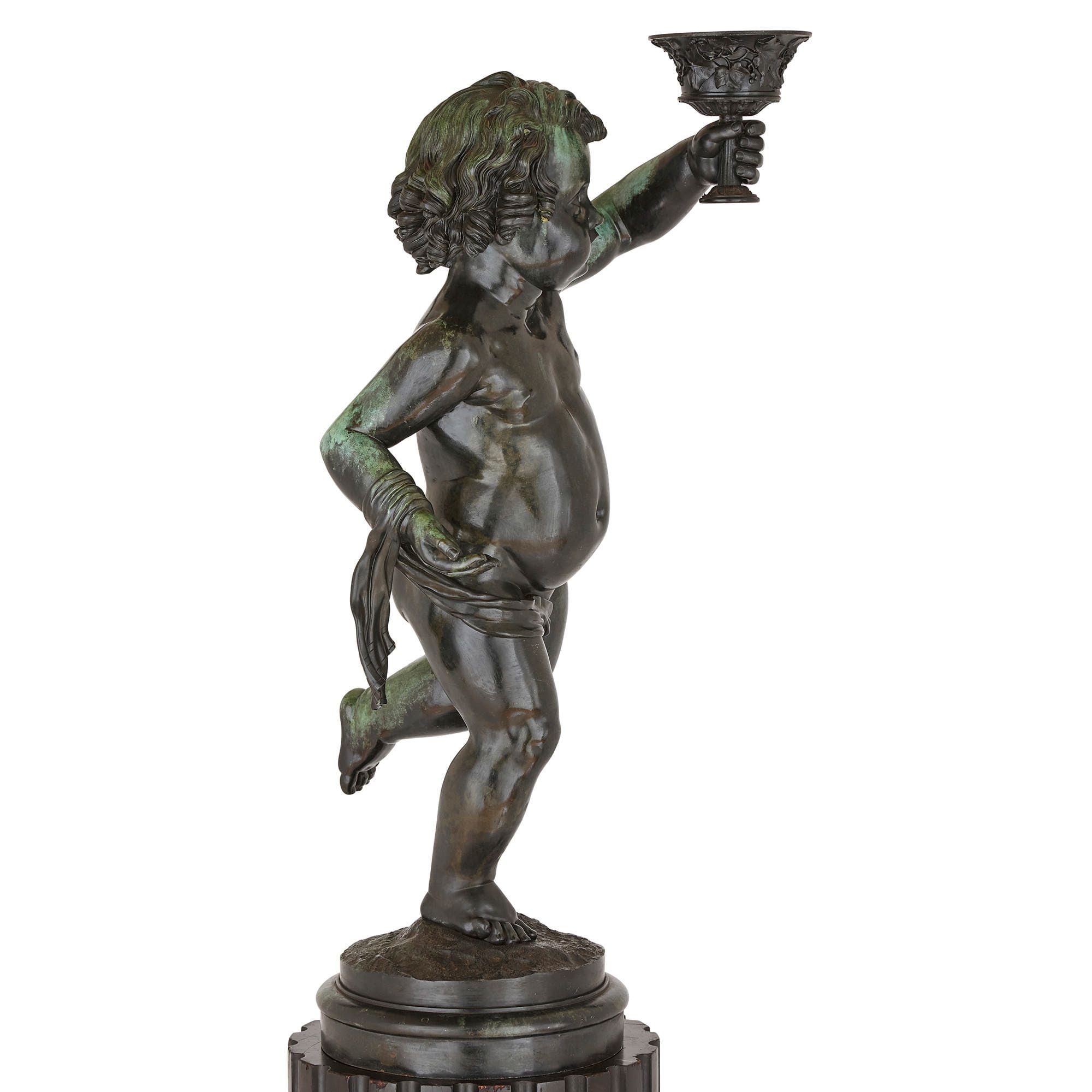 Large antique patinated bronze cherub figure on pedestal | Mayfair Gallery